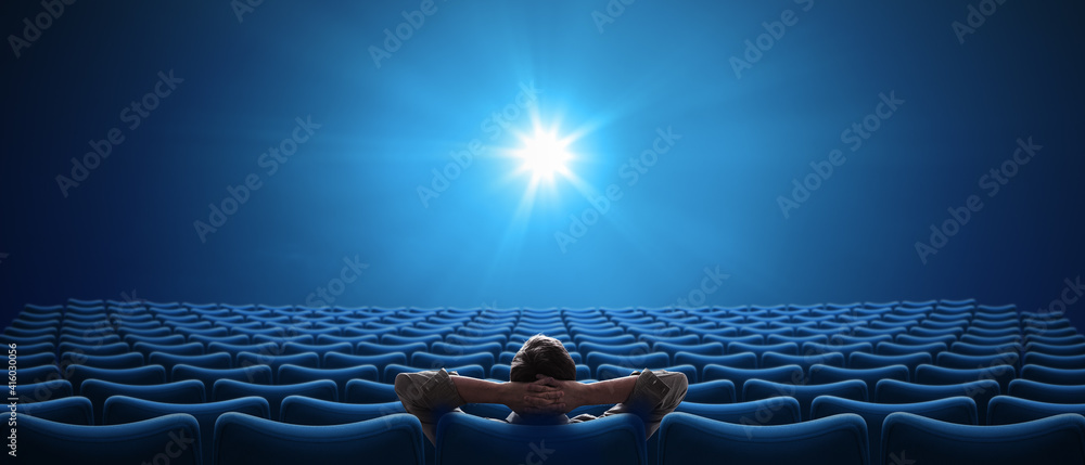 Cinema with one person sitting in 21:9 cinemascope format Stock Photo ...