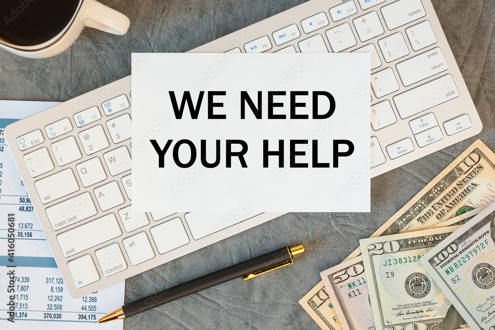 WE NEED YOUR HELP is written in a document on the office desk, diagram ...