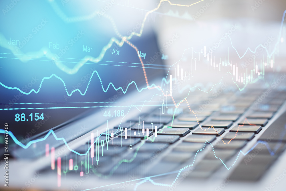 Stock market analysis with financial lines and diagram at laptop ...