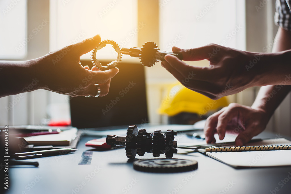 Engineers design gears to drive the engine. Stock Photo | Adobe Stock
