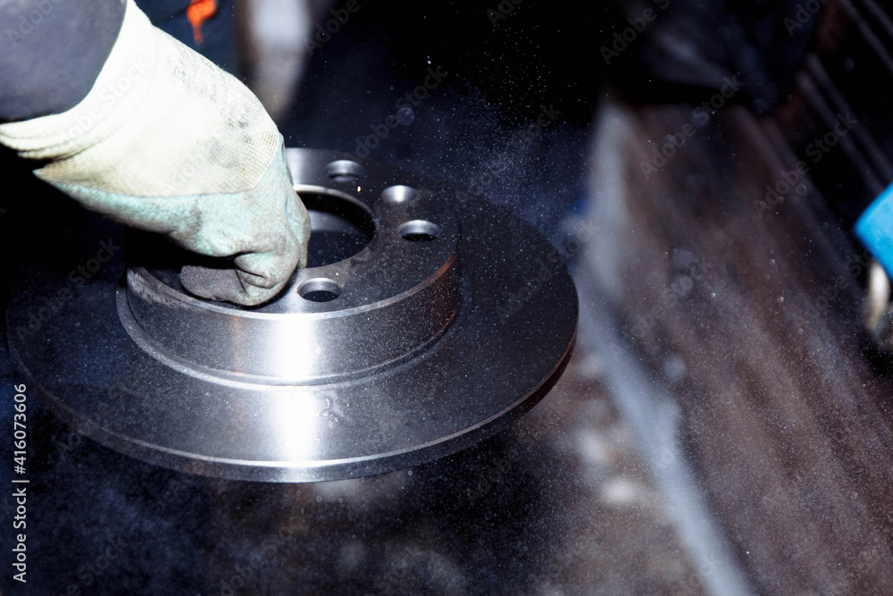 replacing the brake disc of a car in the garage Stock Photo | Adobe Stock