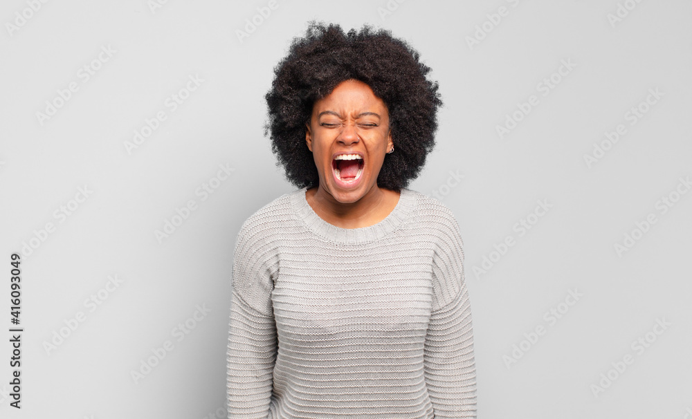 shouting aggressively, looking very angry, frustrated, outraged or ...