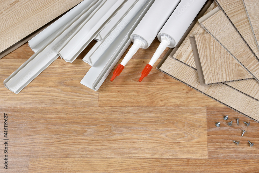 Set of items for PVC ceiling indoor works. Assembly adhesive bottles ...