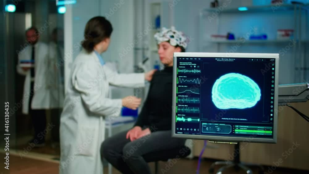 Medical researcher in neurological medicine preparing patient for ...