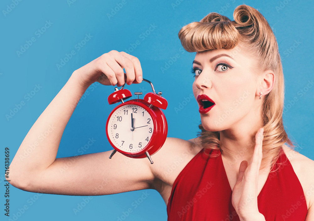 Time. Surprised woman with alarm watch. Pin up girl with alarm clock ...