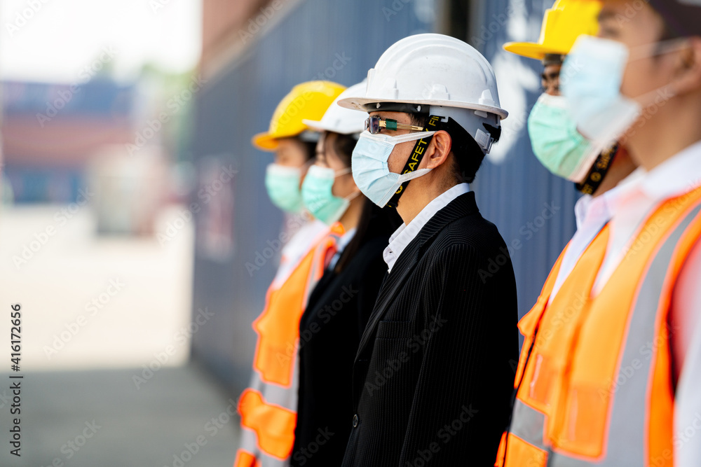 portrait of worker is wearing protection mask face and safety helmet ...