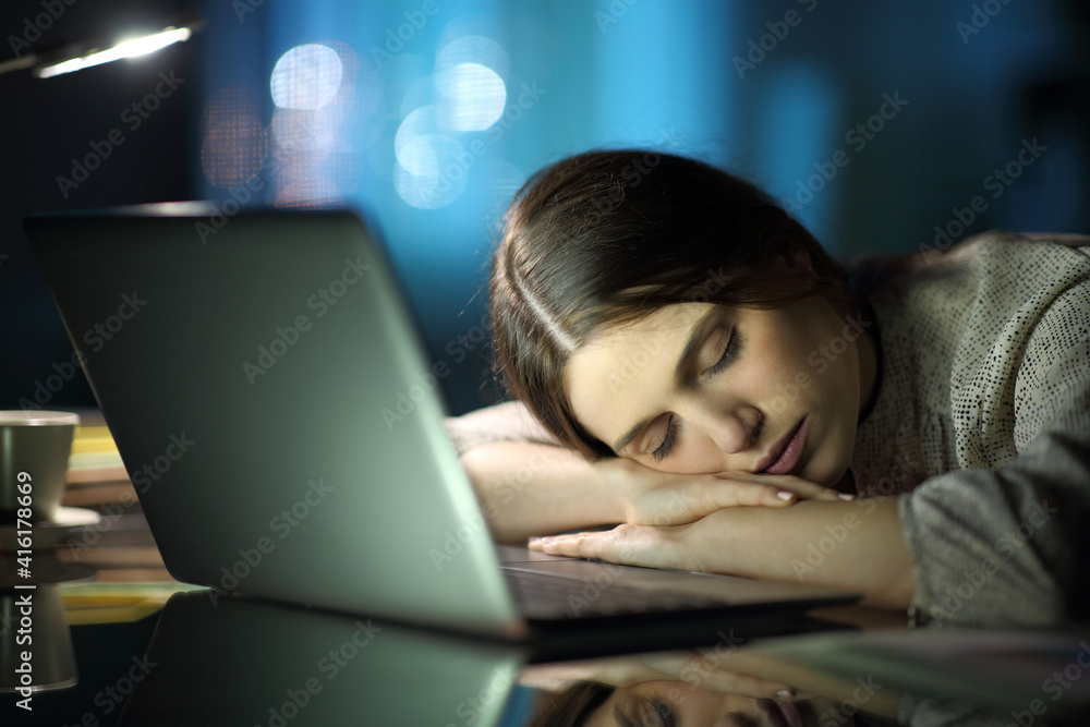 Tired entrepreneur sleeping over laptop late hours in the night Stock ...