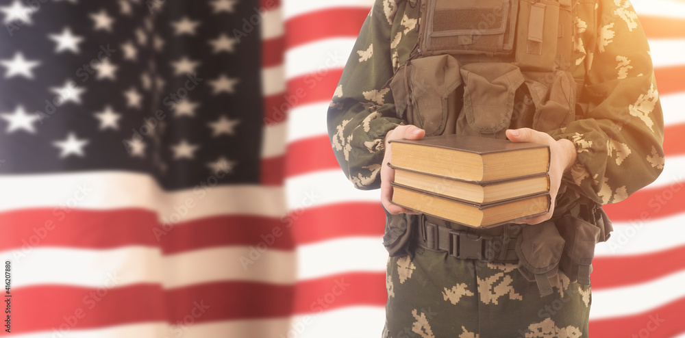 Cadet of military school with books on USA flag background . Stock ...