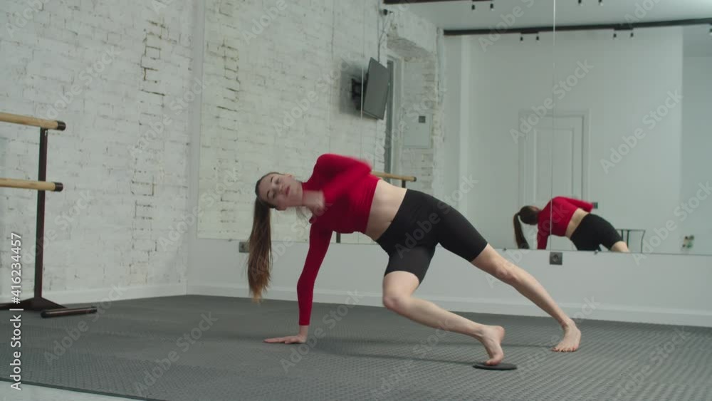 Active motivated attractive sporty fit woman practicing crossover ...