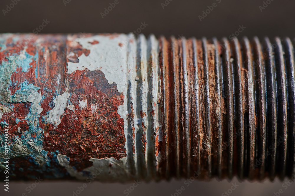 plumbing old rusty water pipe with remnants of sealant and tow on worn ...