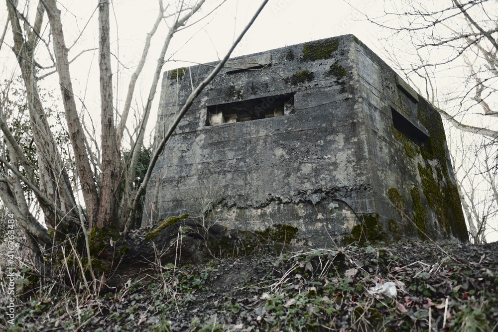 A brutalist cold gritty concrete world war two, ww2, pillbox war bunker ...