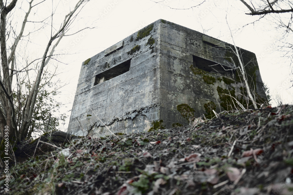 A brutalist cold gritty concrete world war two, ww2, pillbox war bunker ...