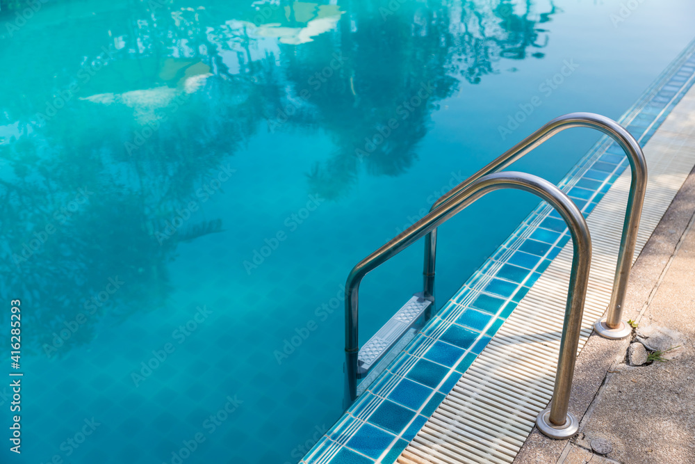 Ladder stainless handrails for descent into swimming pool. Swimming ...