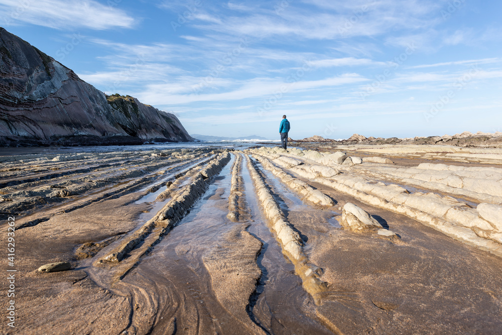 Man standing on a flysch while is looking at the cantabrian sea at ...