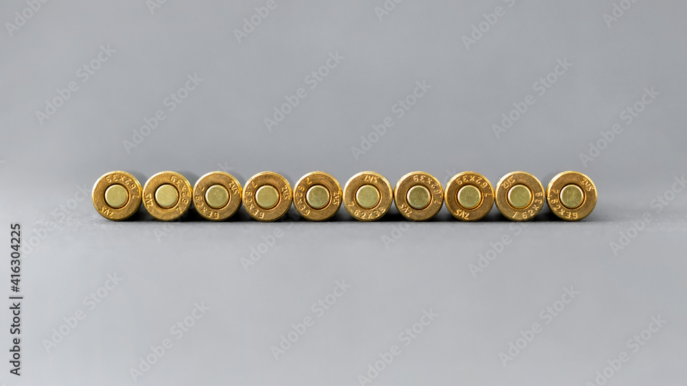 Bullets bottom on gray background. Cartridges 7.62 caliber for ...