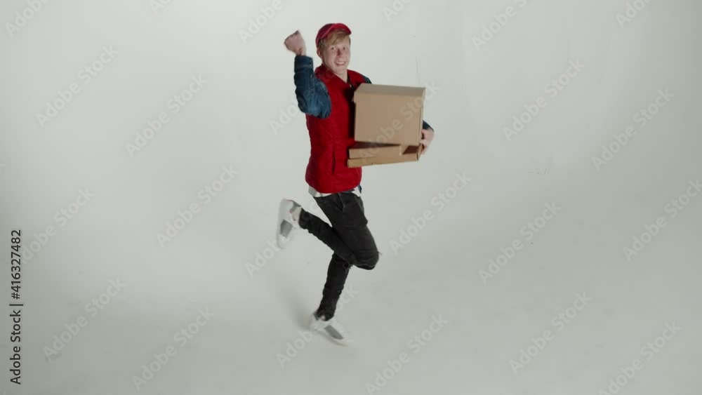 Delivery man dancing in red cap blank t-shirt uniform face mask glove ...