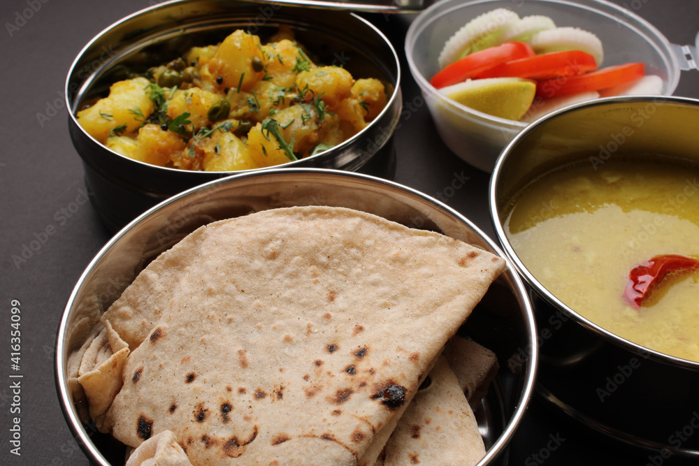 Typical Stainless steel Lunch Box or Tiffin with Maharashtrian food ...