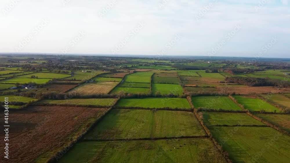 Aerial view of green pastures and small farms in rural Irish ...