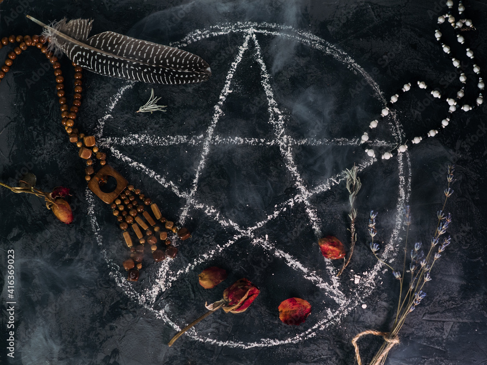 top view of the demon summoning ritual. a pentagram painted on a stone ...