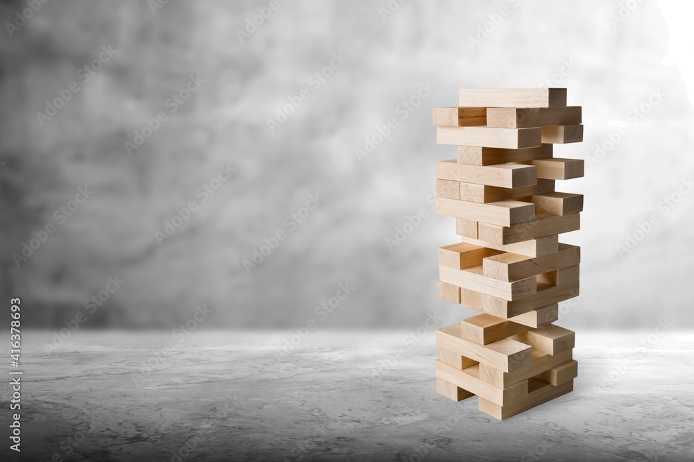 Tower build of wooden blocks, Jenga game Stock Photo | Adobe Stock