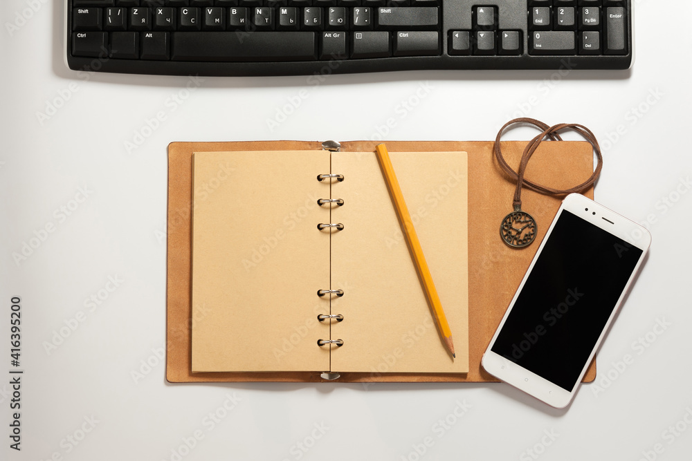 An open notebook with yellowed blank pages, beautiful leather wrapper ...