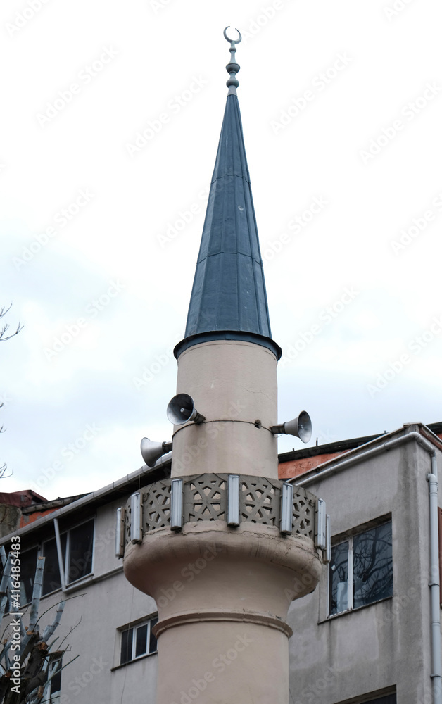 Minaret of a Muslim mosque in downtown Istanbul, Turkey on the ...