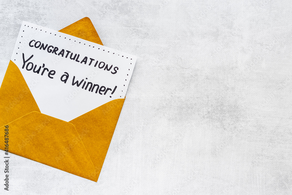 Congratulations award concept -You are a winner card in golden envelope ...