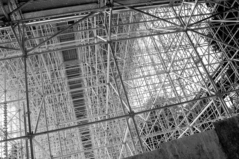 huge metal scaffolding in construction site, texture background of ...