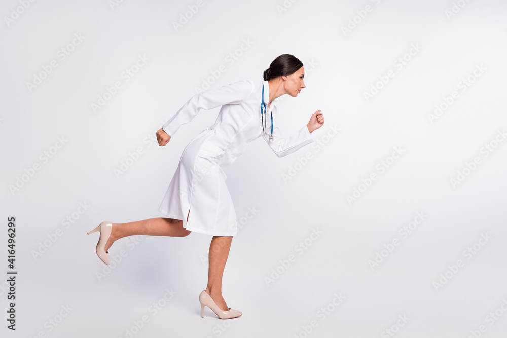 Full length photo of purposeful pretty young lady physician dressed ...