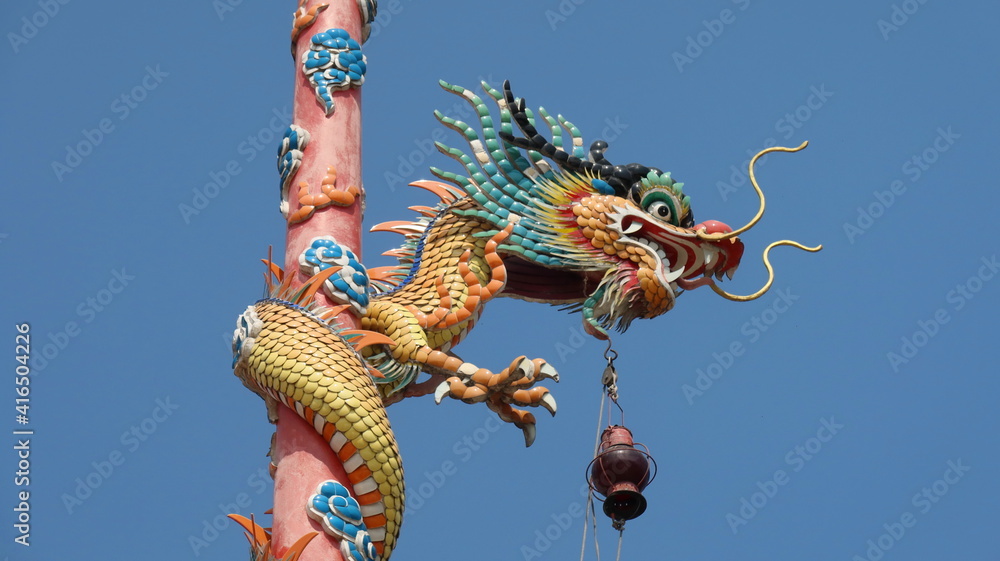 Colorful dragon column soars into blue sky at Chinese shrine Stock ...