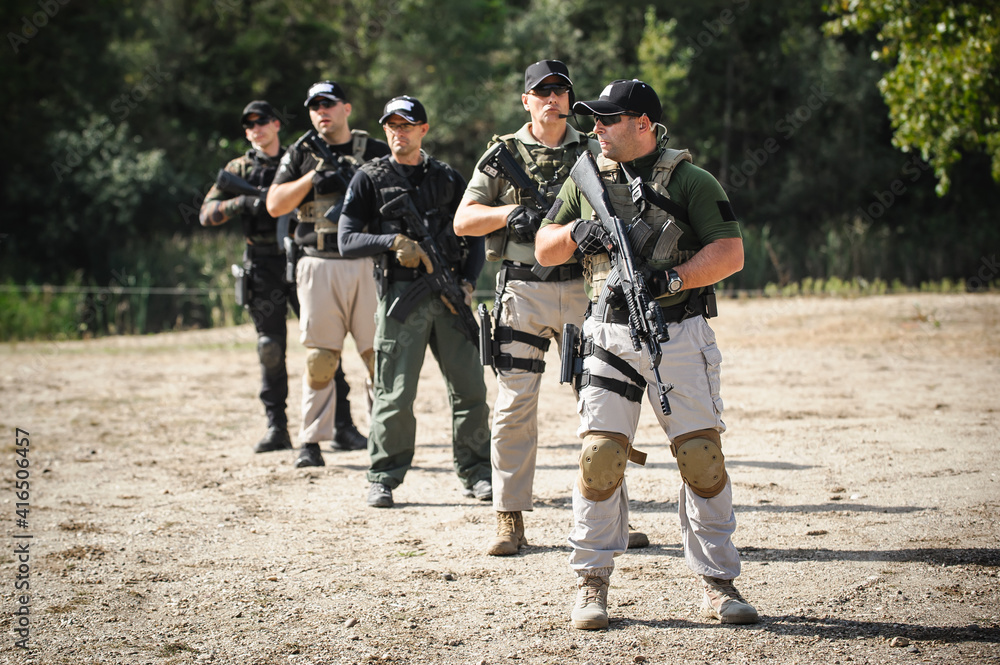 Military army soldiers in action tactical combat shooting from rifle ...