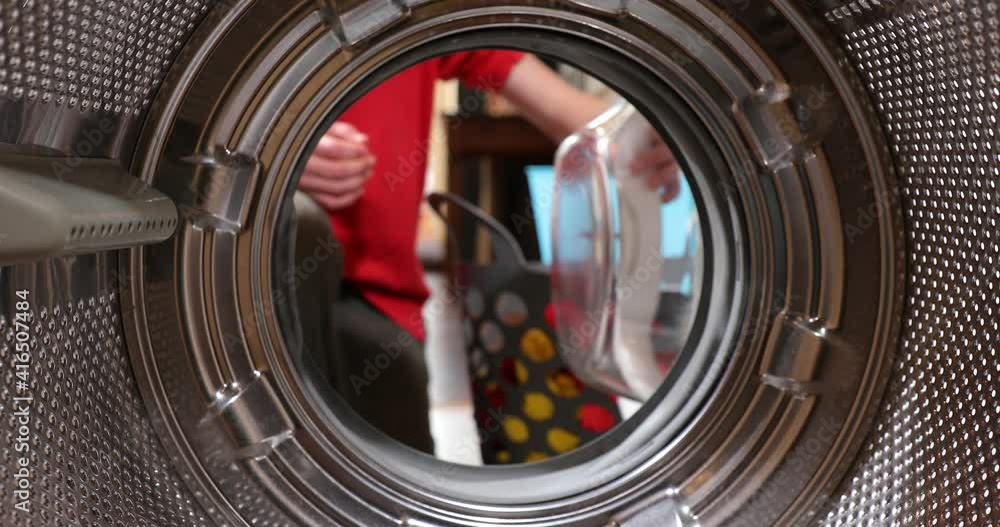 View Looking Out From Inside Washing Machine As boy Puts In Laundry ...