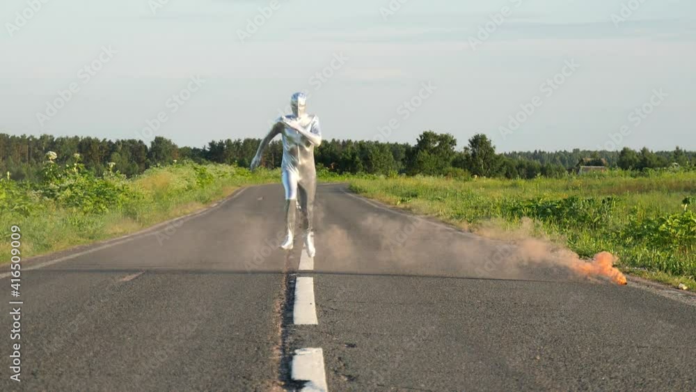 Video „Tall slender man in silver suit is fully dressed in tight silver ...