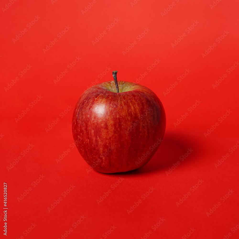 Red apple isolated on red background. Apples contain vitamin C. Apples ...