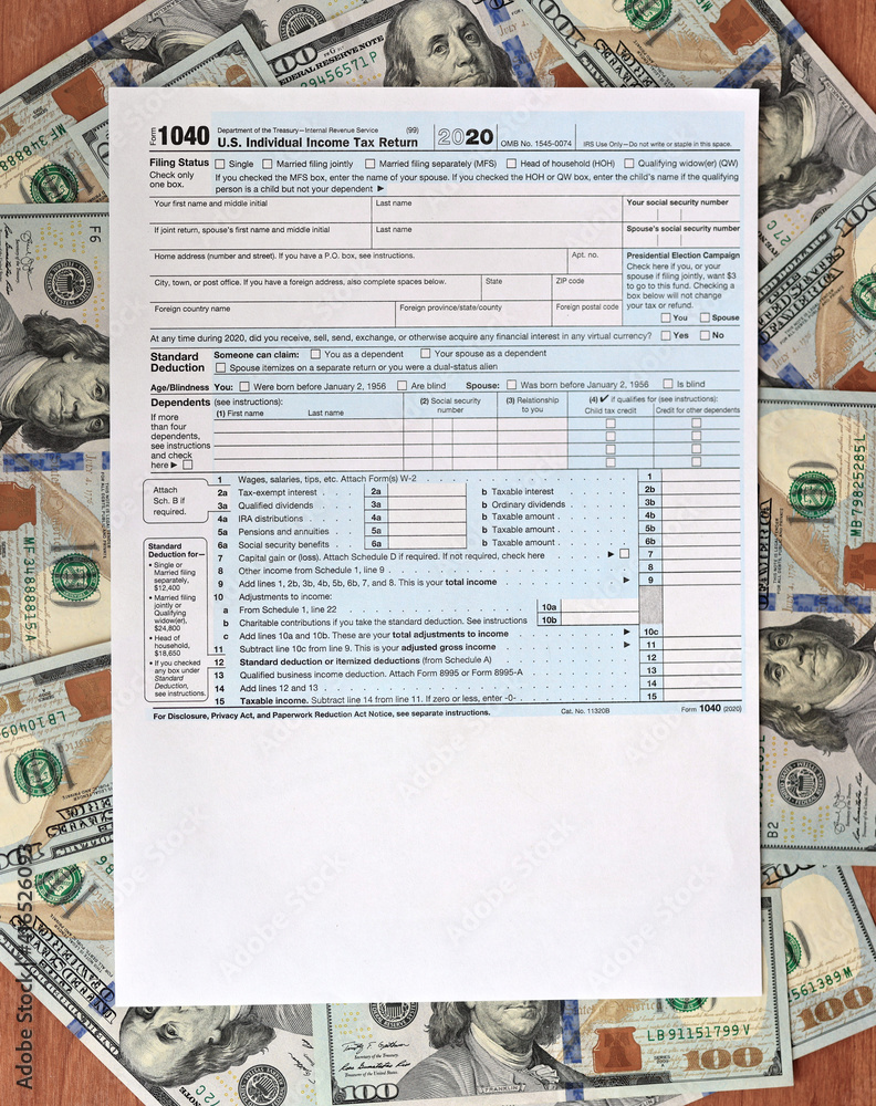 One hundred dollar bills and US 1040 tax form. Calculating your tax ...