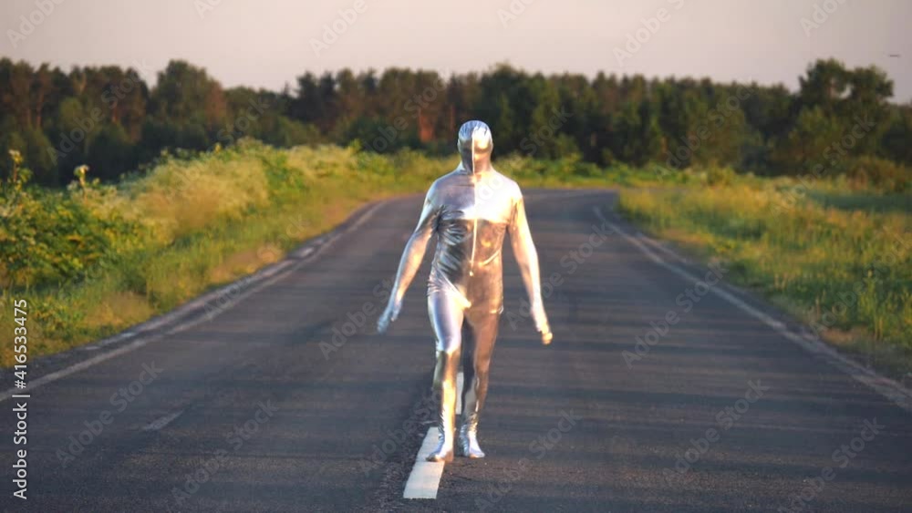 Video „Tall slender man in silver suit is fully dressed in tight silver ...