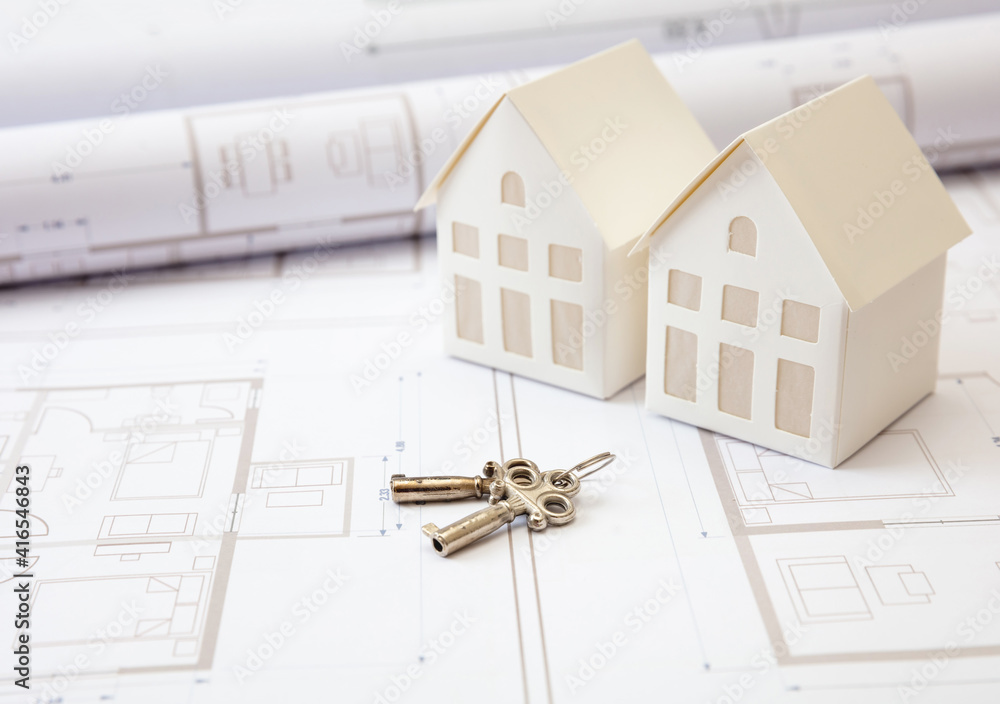 Construction concept. Residential building drawings and house keys on ...