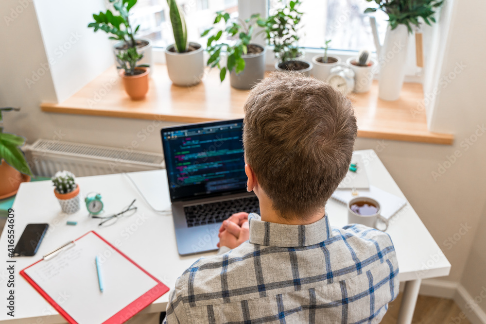 Closeup coding on screen, man's hands coding and programming on screen ...