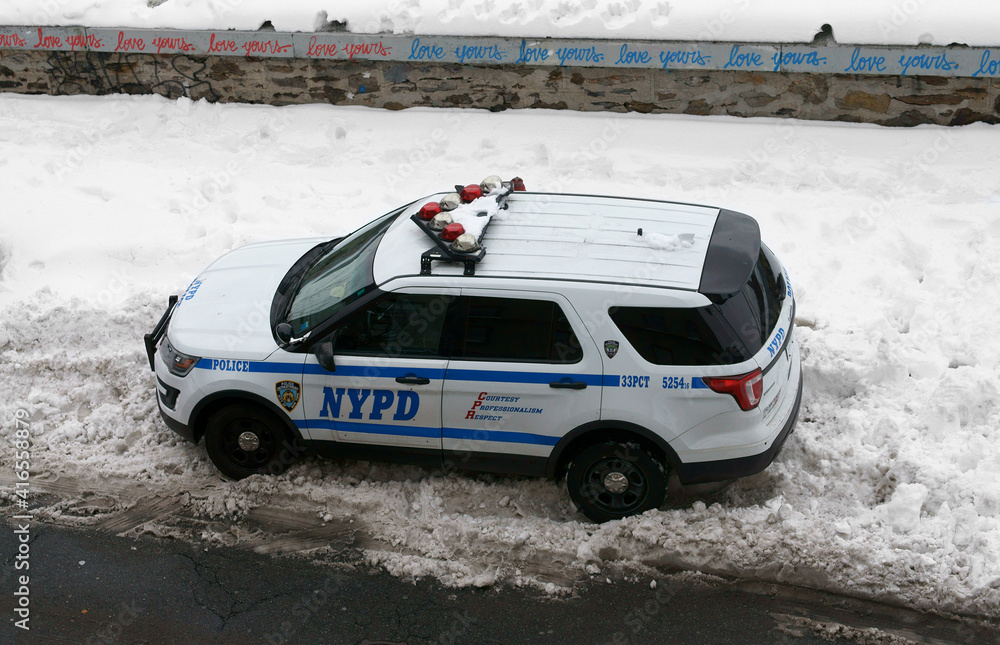 New York City Police Department vehicle on side of road in snowy winter ...