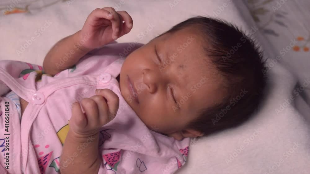 Newborn scared Baby tremble while sleeping. Baby trembles in fear in ...