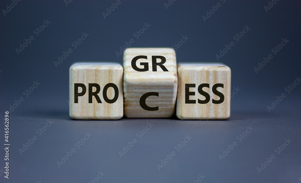 Process and progress symbol. Turned a wooden cube and changed the word ...