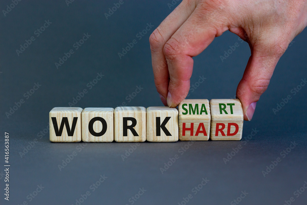 Work hard or smart symbol. Businessman turns wooden cubes and changes ...