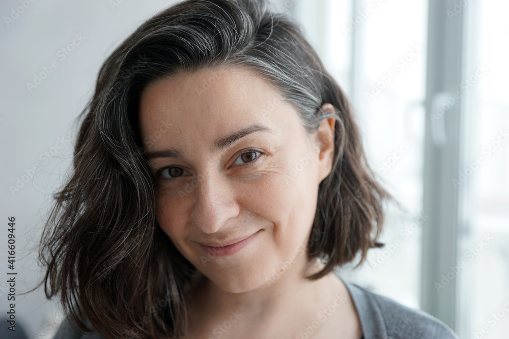 Portrait of 38 year old woman against home office background Stock ...