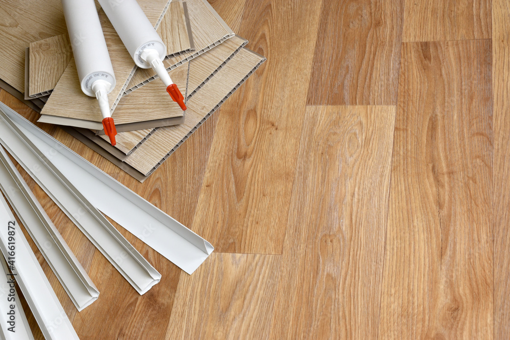 Set of items for PVC ceiling indoor works. Assembly adhesive bottles ...