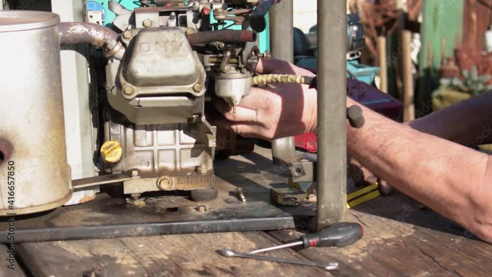 Professional mechanic repair defect engine of emergency power generator ...
