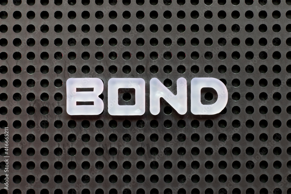 White color letter in word bond on black pegboard background Stock ...
