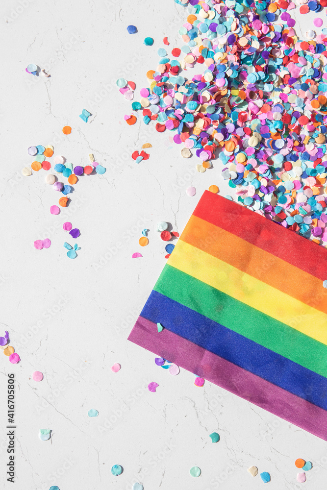 gay pride flag next to confetti top view. lgbt party background Stock ...
