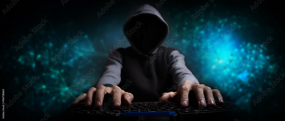 Cybersecurity, computer hacker with hoodie Stock Photo | Adobe Stock
