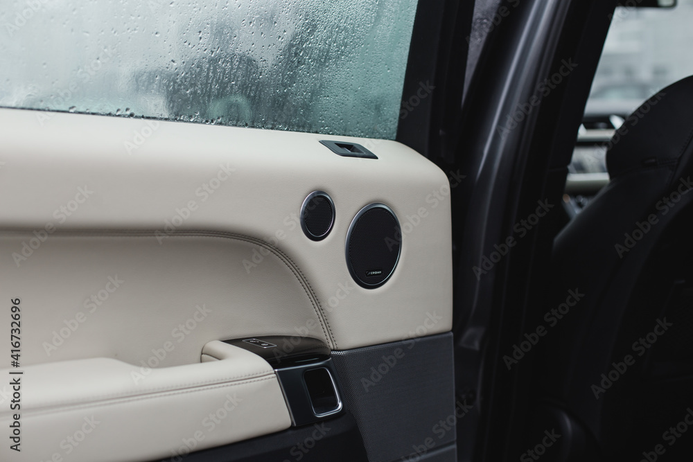 inside car door with beige and black leather Stock Photo | Adobe Stock