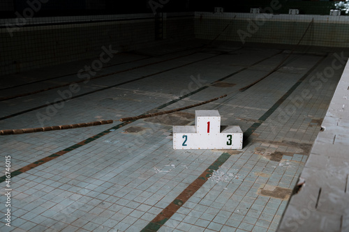 Abandoned swimming pool with victory podium in the Ghost Town of ...